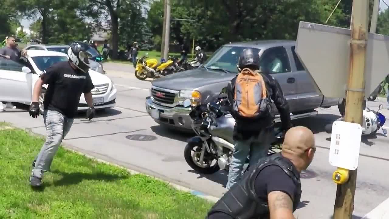 ">>the truck charges,knocks over a motorcycle And runs over its wheel ...