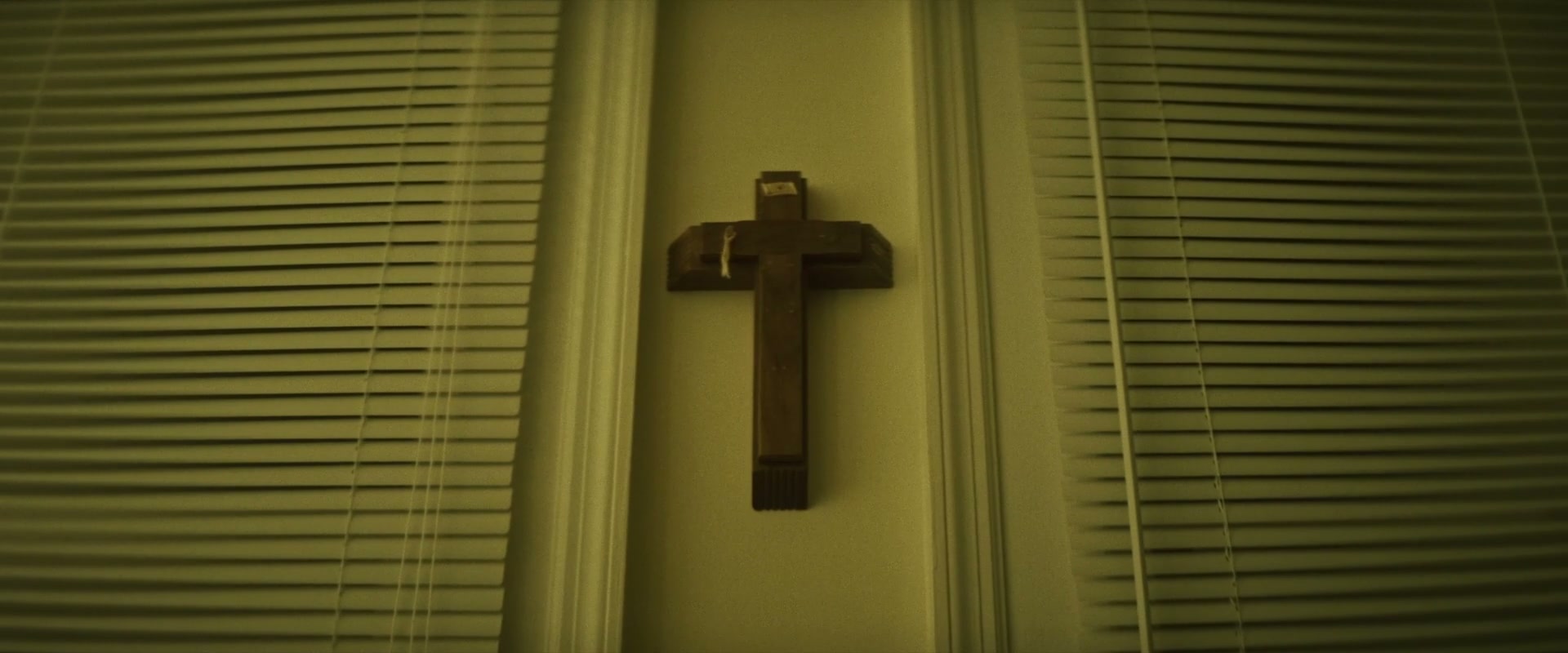 This crucifix only hung onthe wall with a single nail. - The Unbinding ...