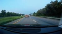 The two drivers apparentlyexchange words one more time As their cars ...